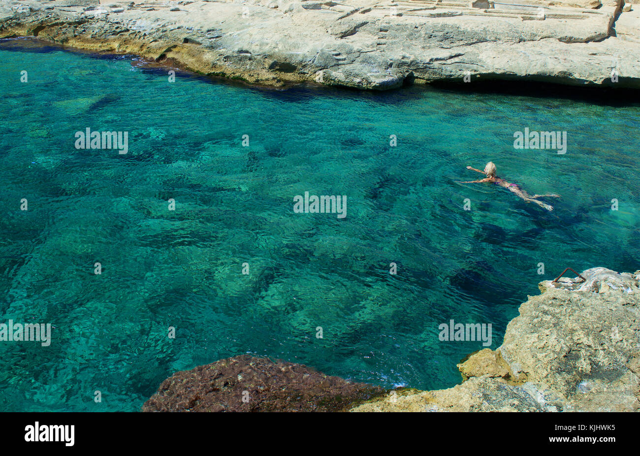 Woman swimming in sea, Gozo island, Malta Stock Photo - Alamy