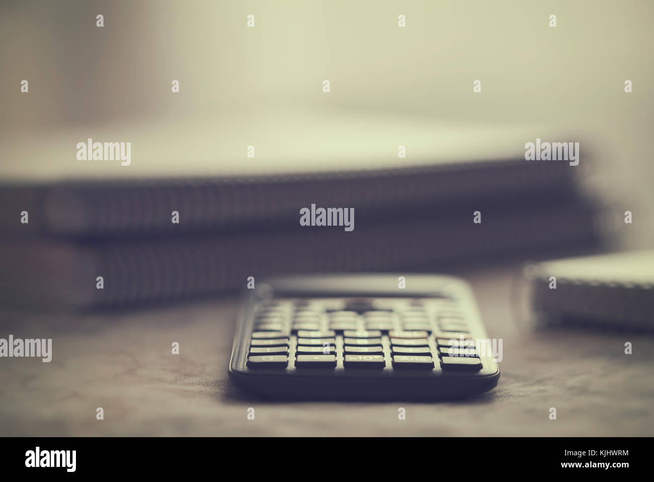 Close-up of a calculator and notebook Stock Photo - Alamy