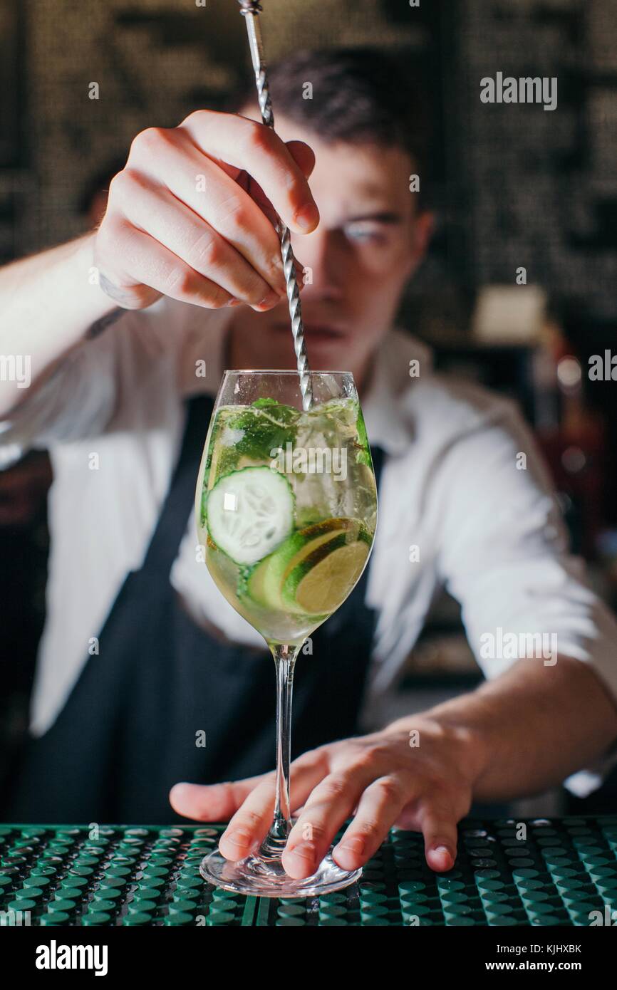Barman mixing a cocktail Stock Photo - Alamy