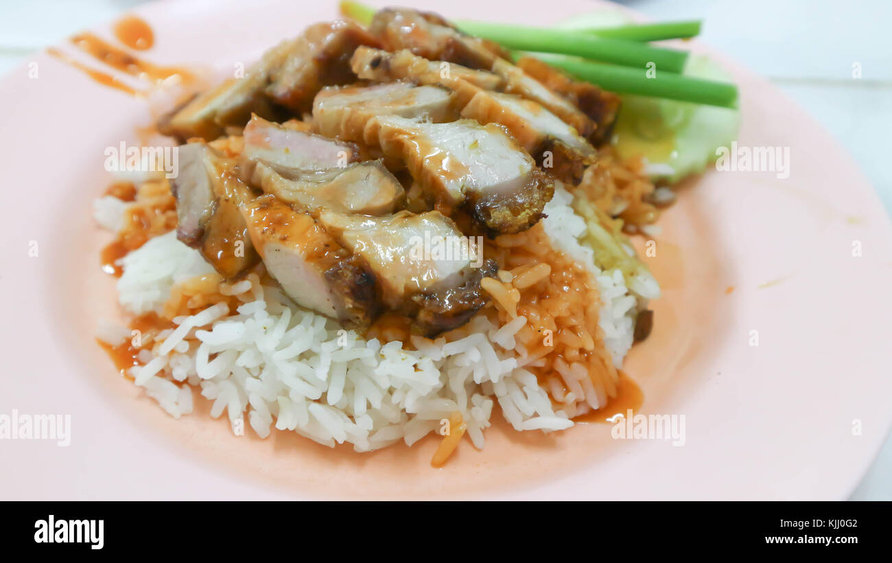 crispy pork with rice, rice topped with crispy pork Stock Photo - Alamy