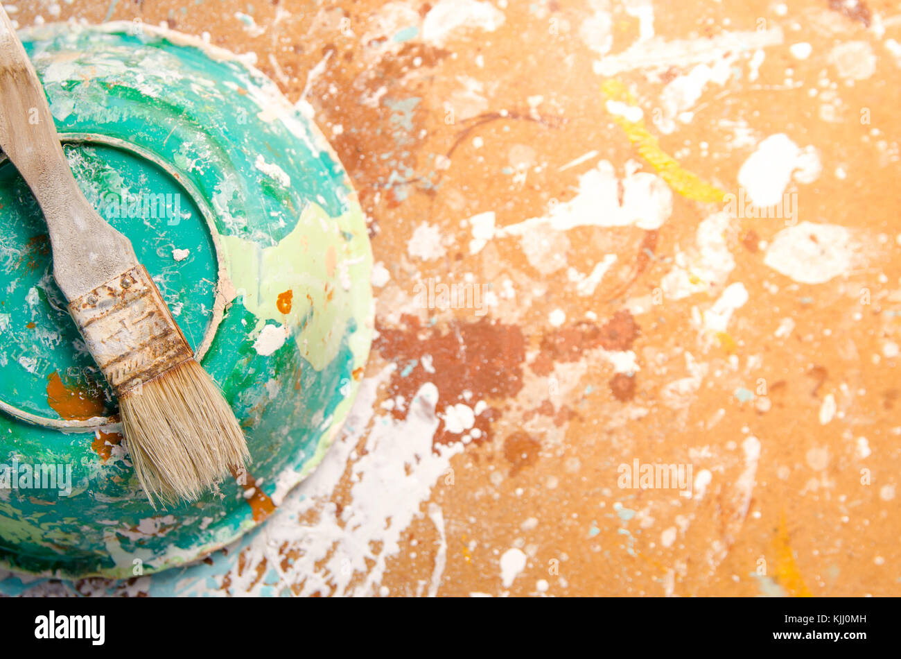 a brush on a inverted bowl on a hardboard stained with a paint Stock ...