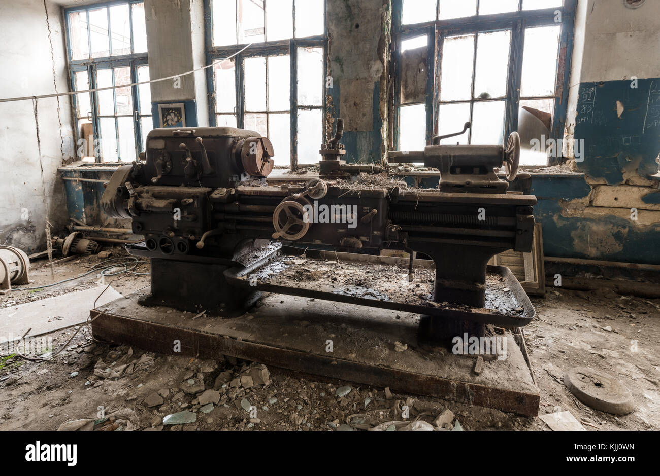 Old abandoned factory rooms, lathes Stock Photo - Alamy