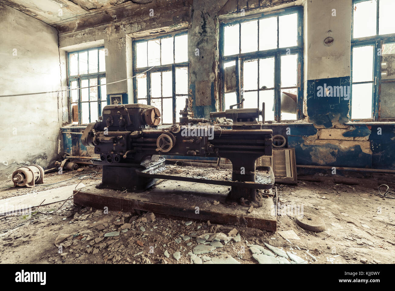 Old abandoned factory rooms, lathes Stock Photo - Alamy
