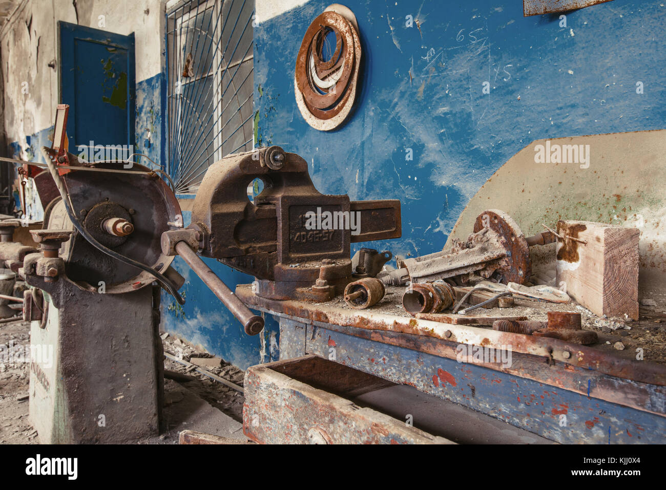 Old abandoned factory rooms, work table Stock Photo - Alamy