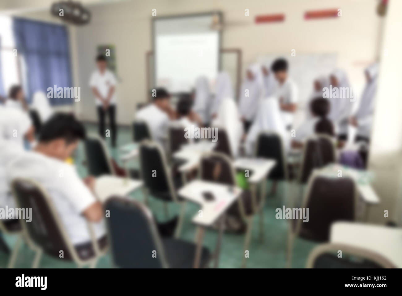 blur Blurred abstract background of university students sitting in a ...