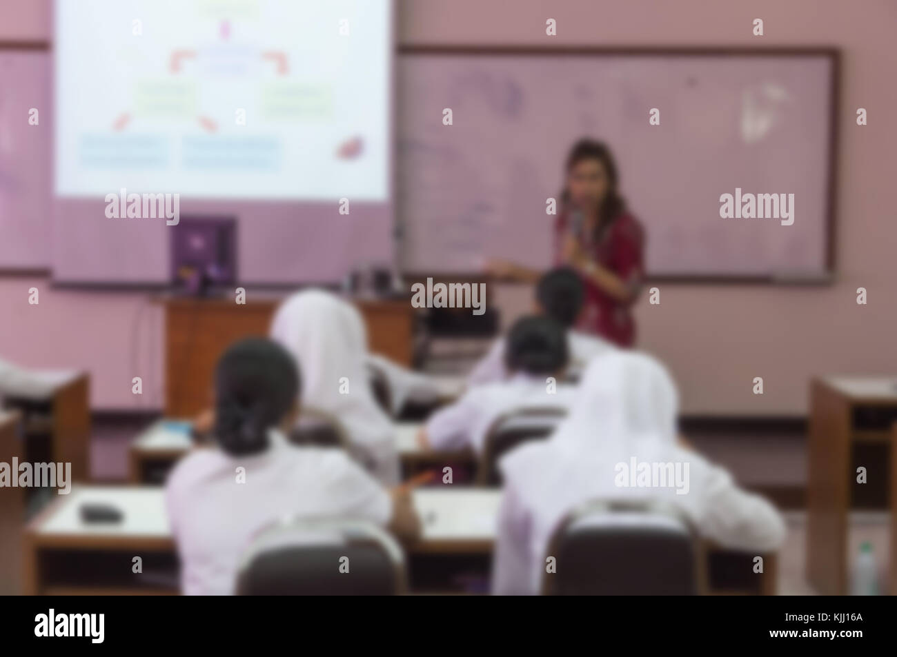 Blurred abstract background of university students sitting in a lecture ...