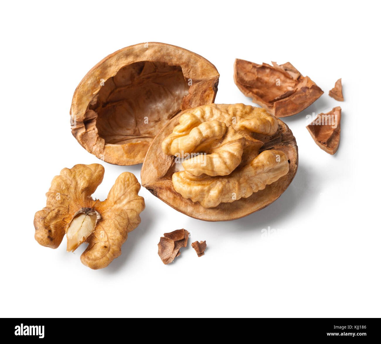 walnut and a cracked walnut isolated on the white background. with ...
