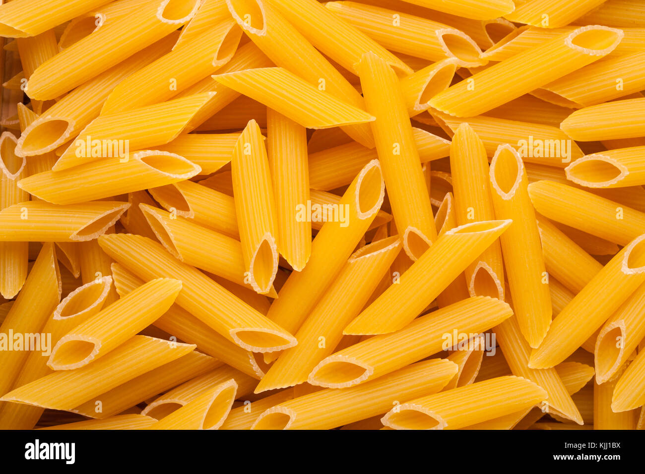 Italian Penne Rigate Macaroni Pasta raw food background or texture ...