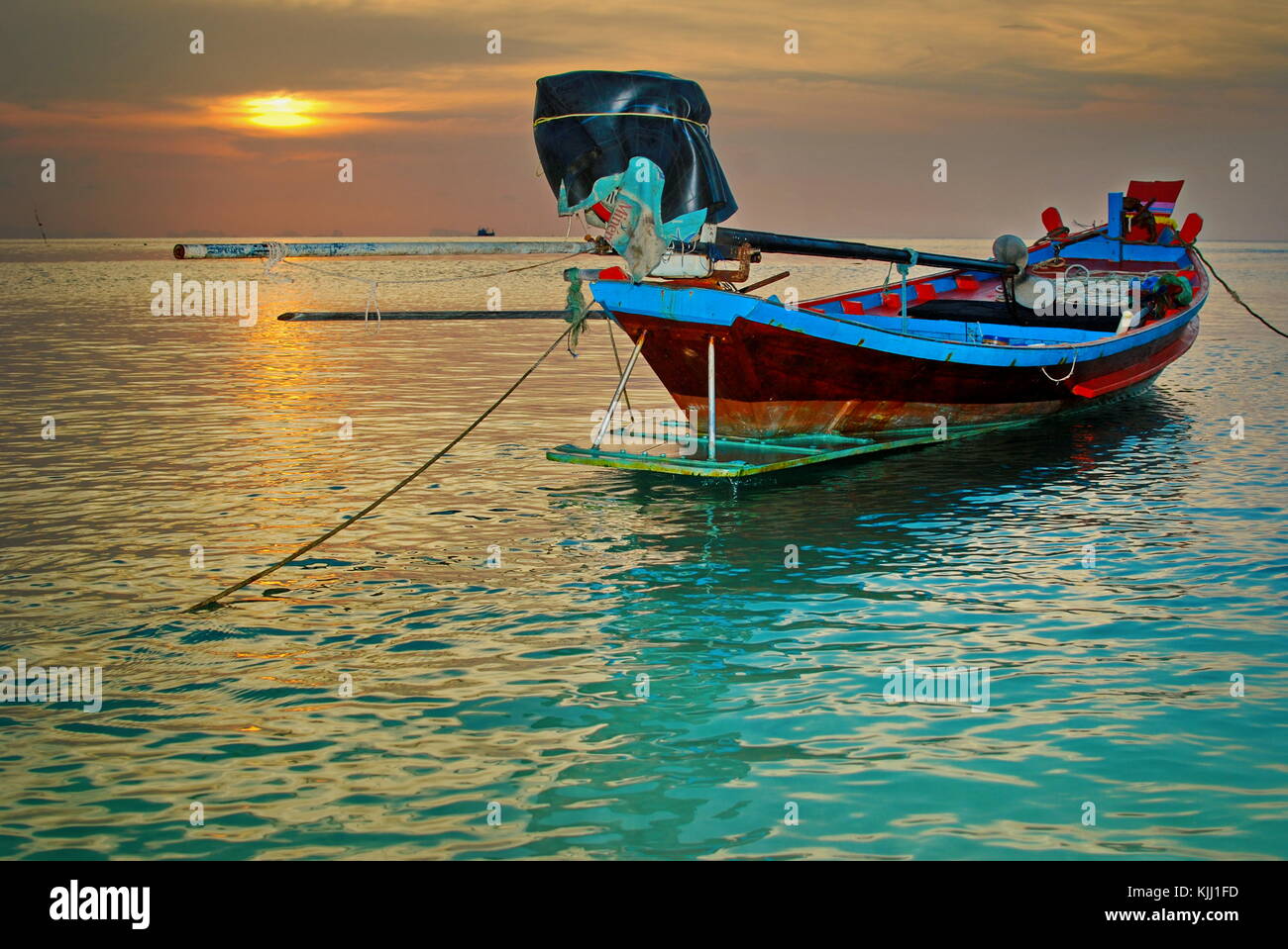 Colorful traditional fishing boat on the sea in Thailand Asia at sunset ...