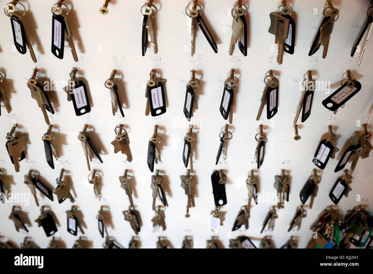 Room keys hanging on numbered hooks. France Stock Photo - Alamy