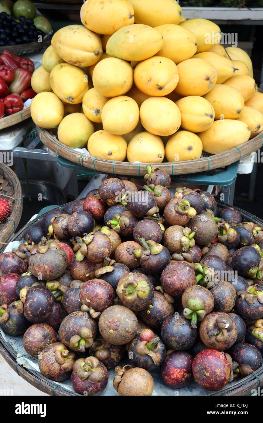 Mangosteens and mangoes for sale at market. Hoi An. Vietnam Stock Photo ...