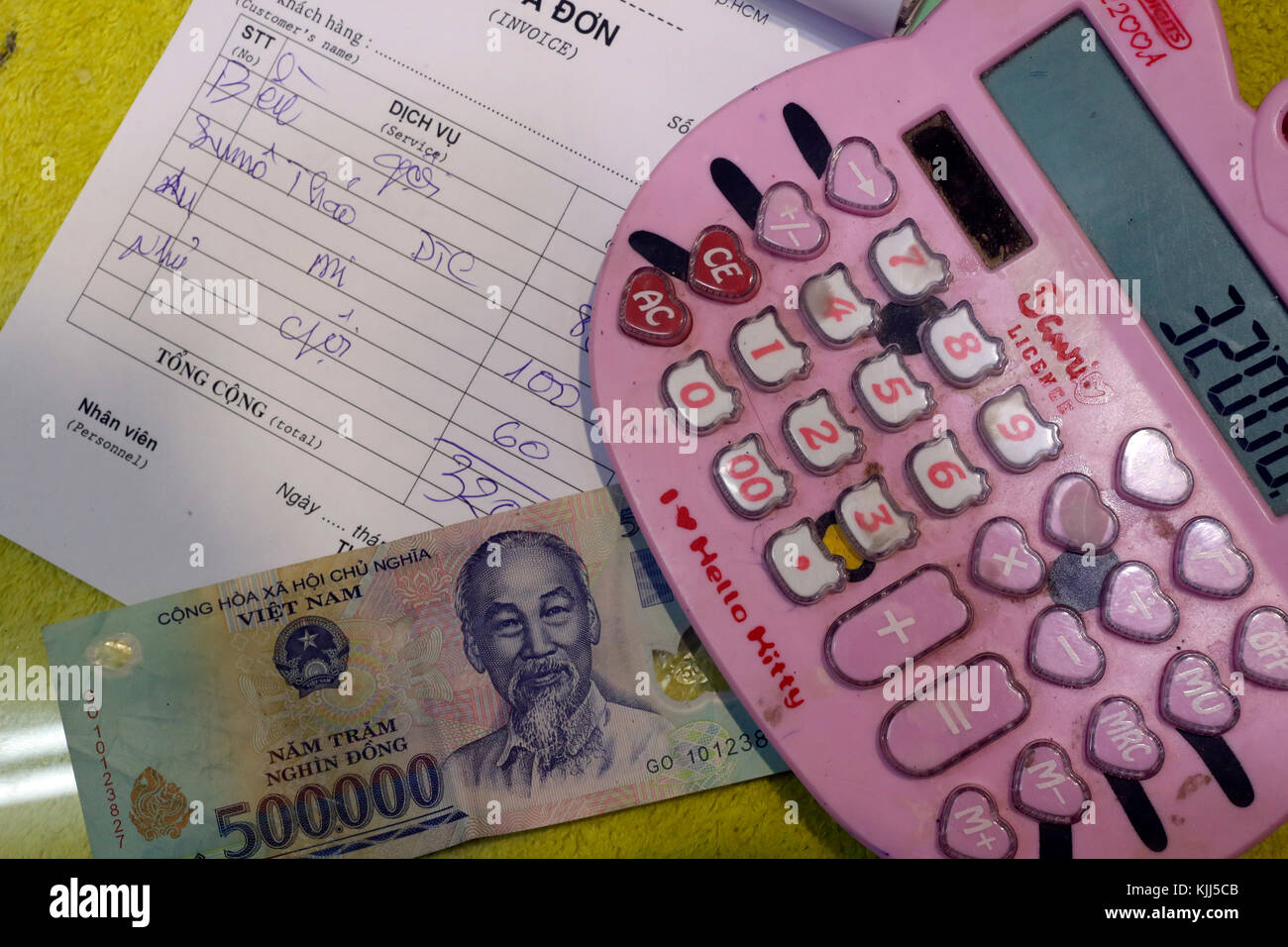 Vietnamese currency, the Dong. Bill with bank note. Ho Chi Minh City ...