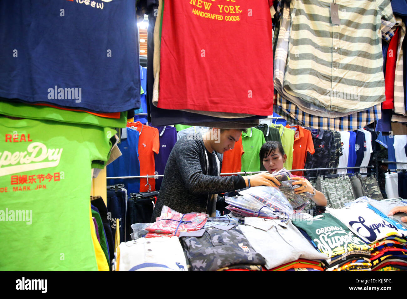 Clothing Market. Hangers with clothes. Vietnam Stock Photo - Alamy