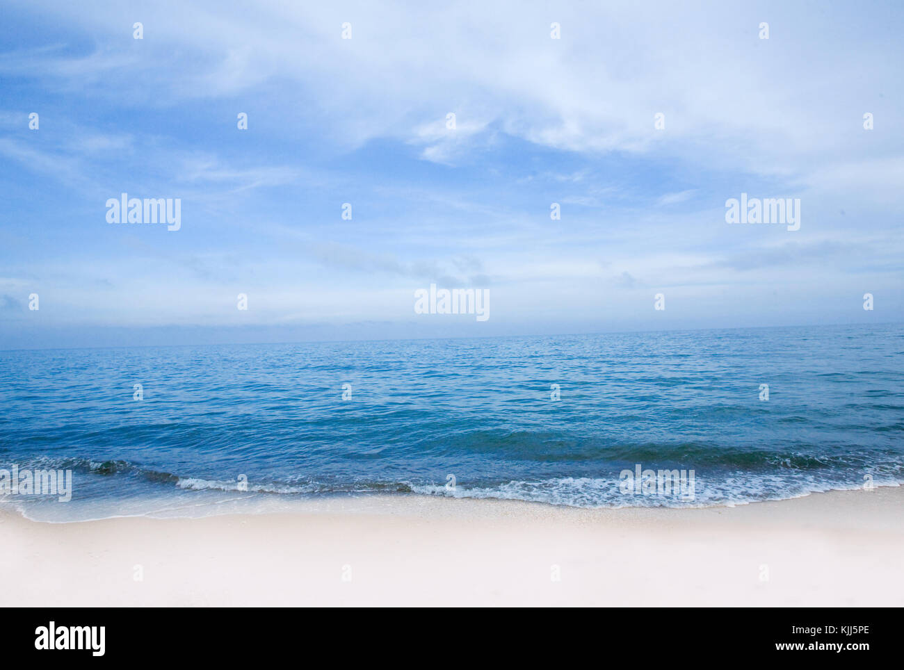 Blue sea with waves and sky with airy clouds Stock Photo - Alamy