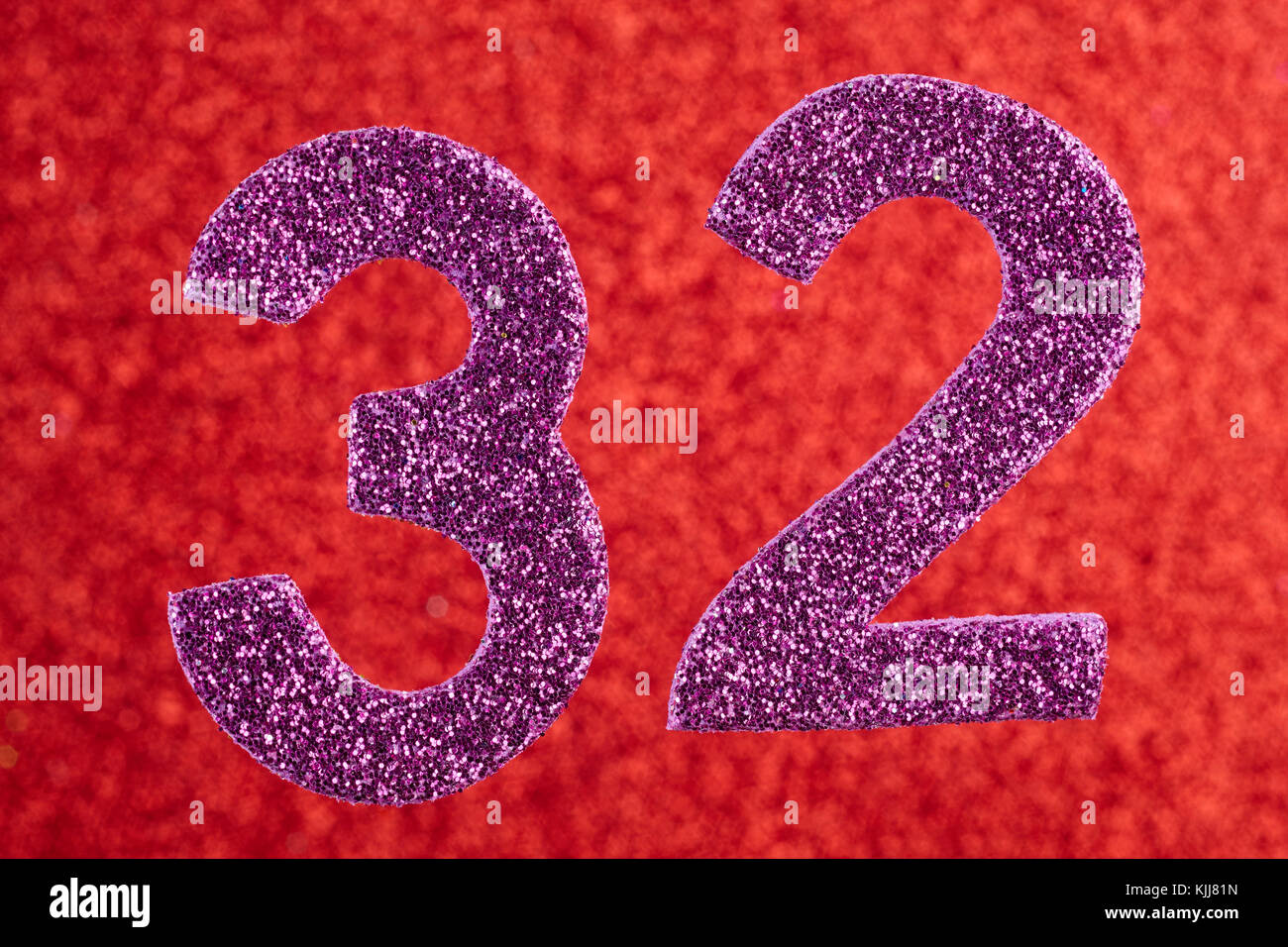 Number thirty-two purple color over a red background. Anniversary ...