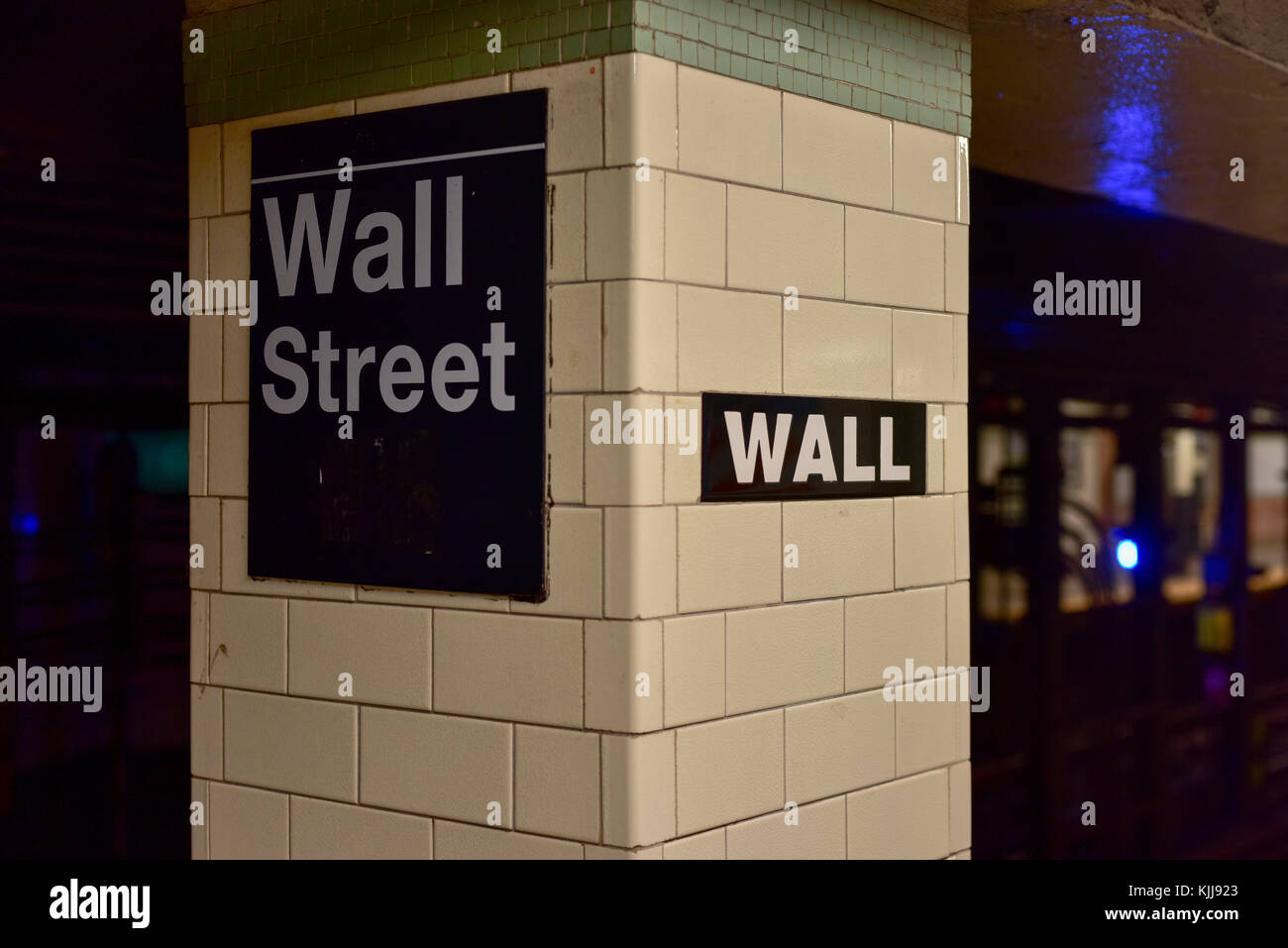 Wall street subway sign tile pattern in New York City Manhattan station ...