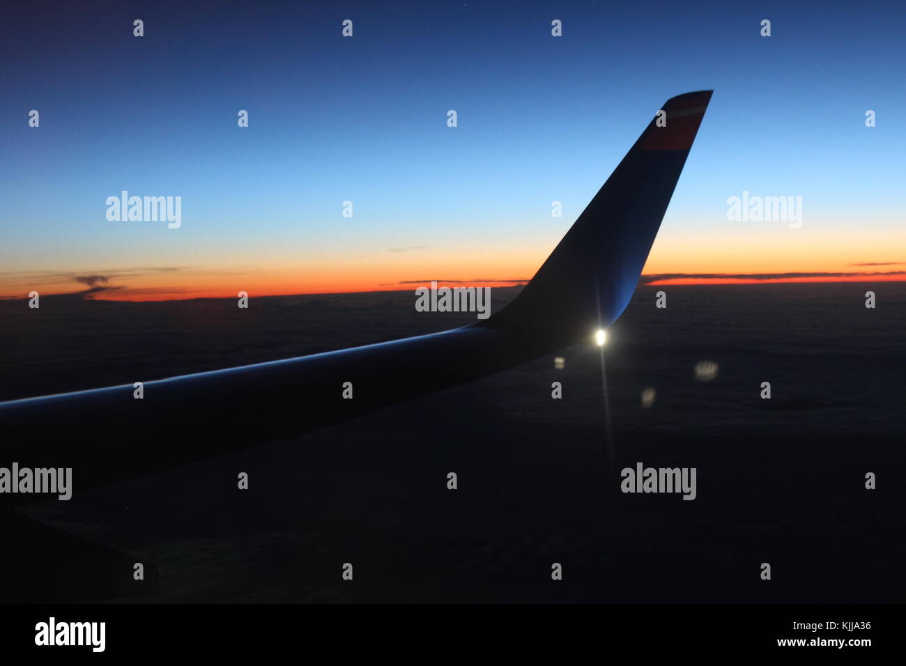 Window view in a cabin of airplane in the sky Stock Photo - Alamy
