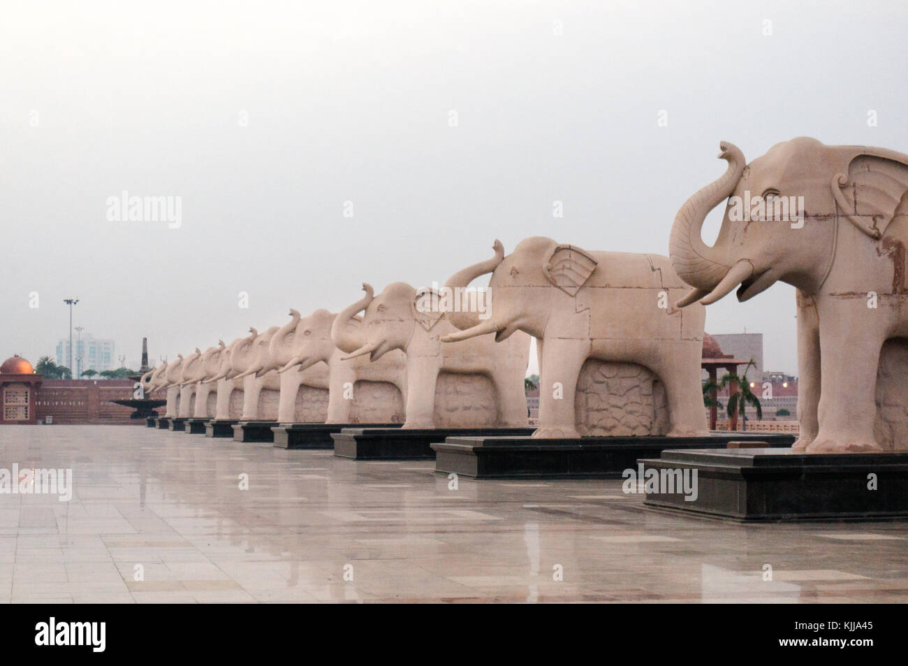 Statues of elephants placed in a straight line Stock Photo - Alamy
