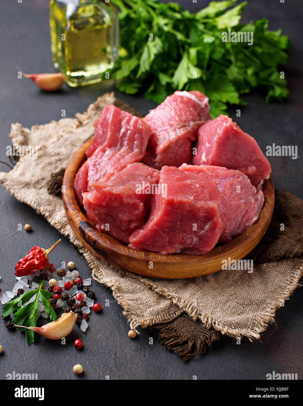 Raw chopped meat with spices on rusty background. Selective focus Stock ...