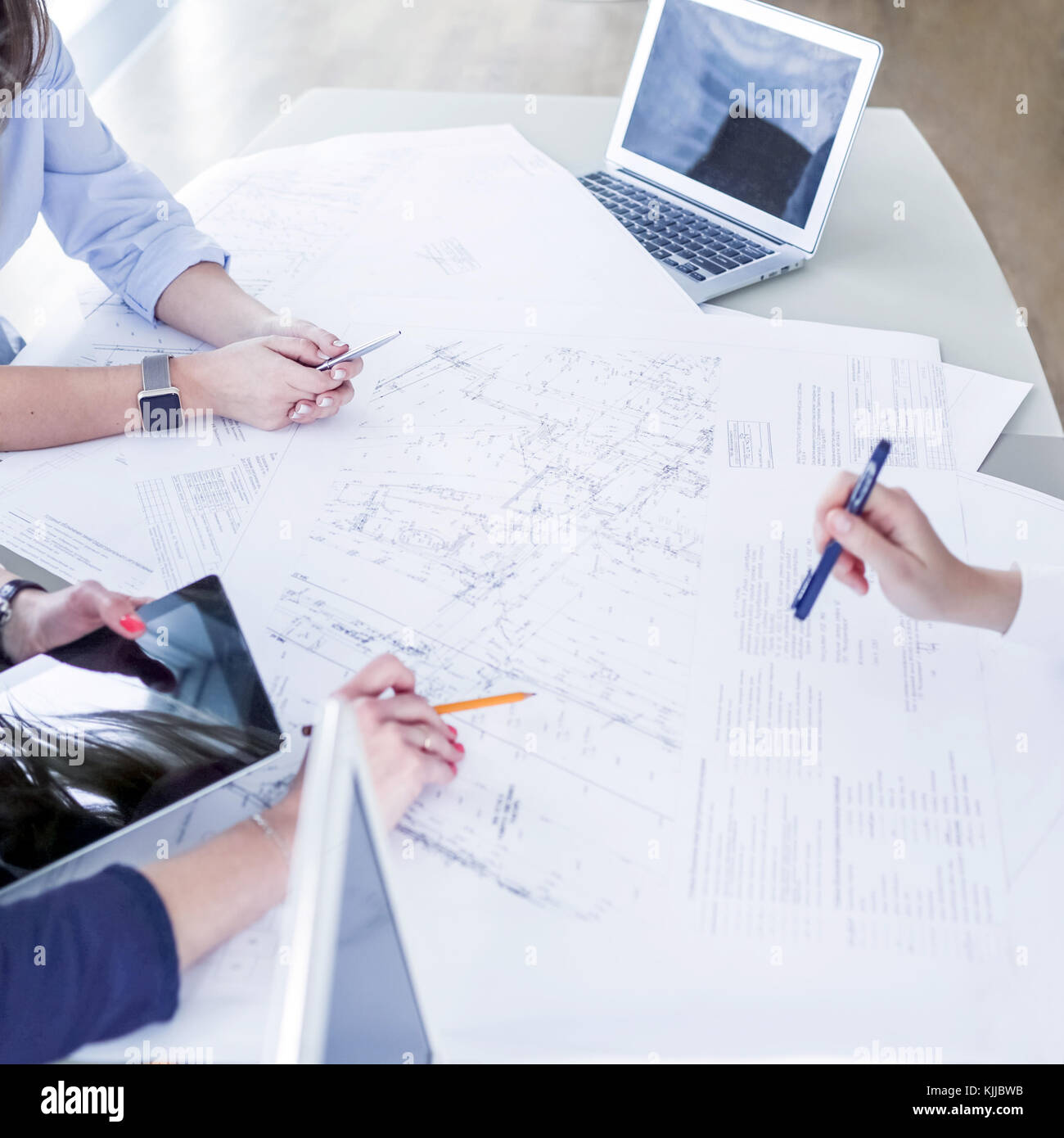 Business women working with business project using business drawings ...