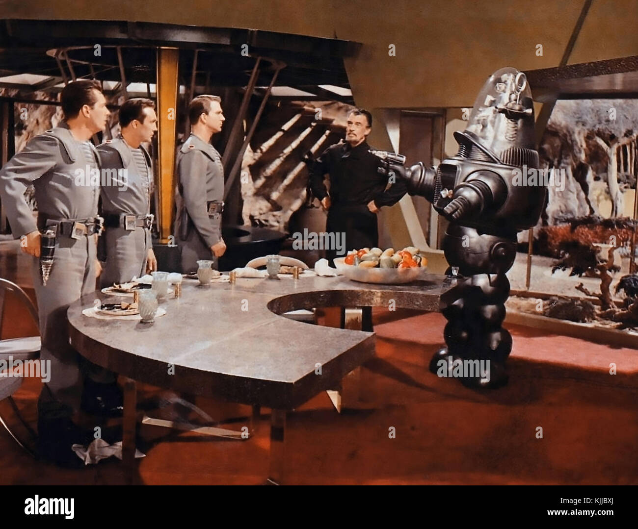 FORBIDDEN PLANET 1956 MGM science fiction film with from right: Robby ...