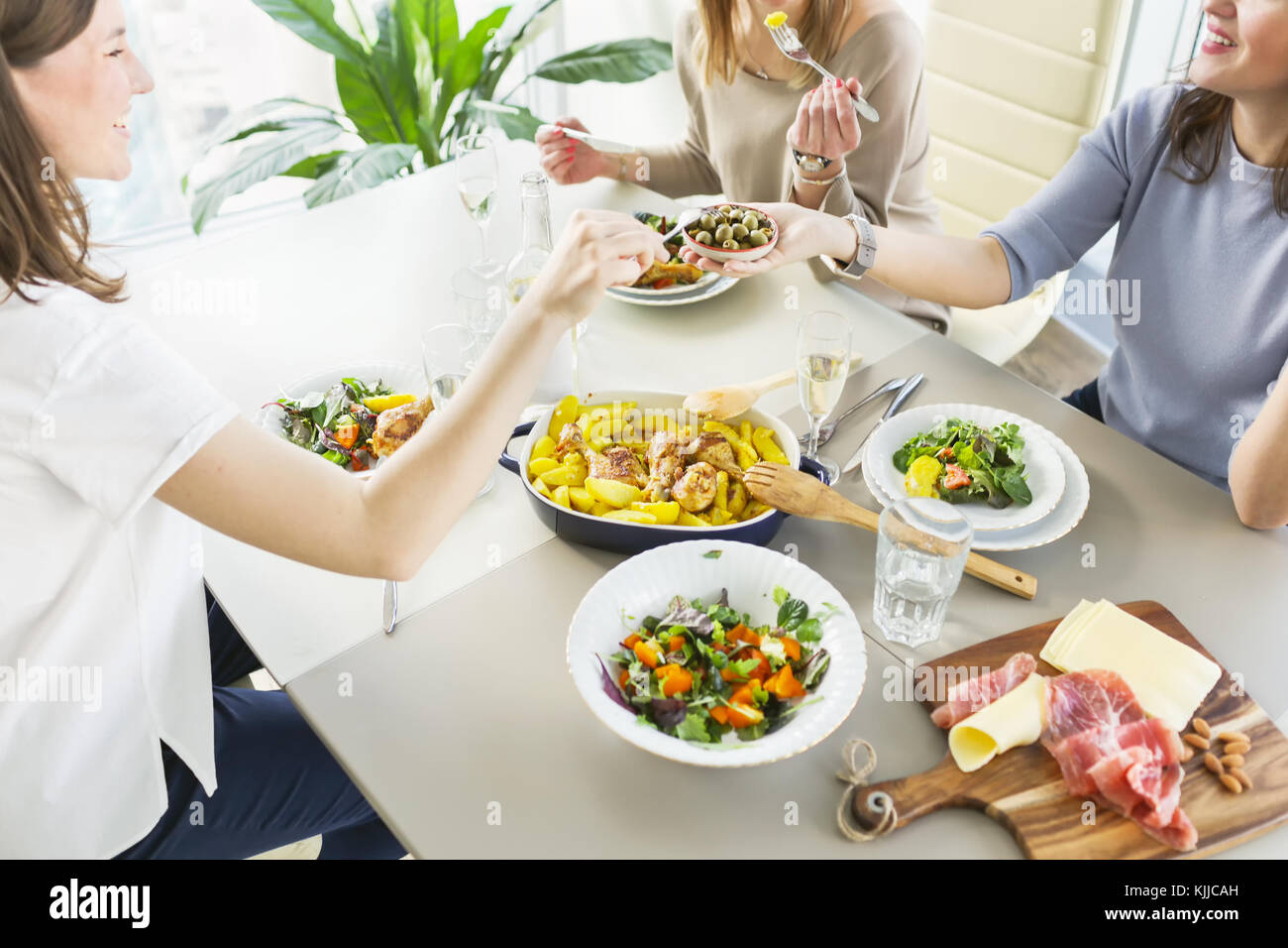 Group of women having dinner together Stock Photo - Alamy