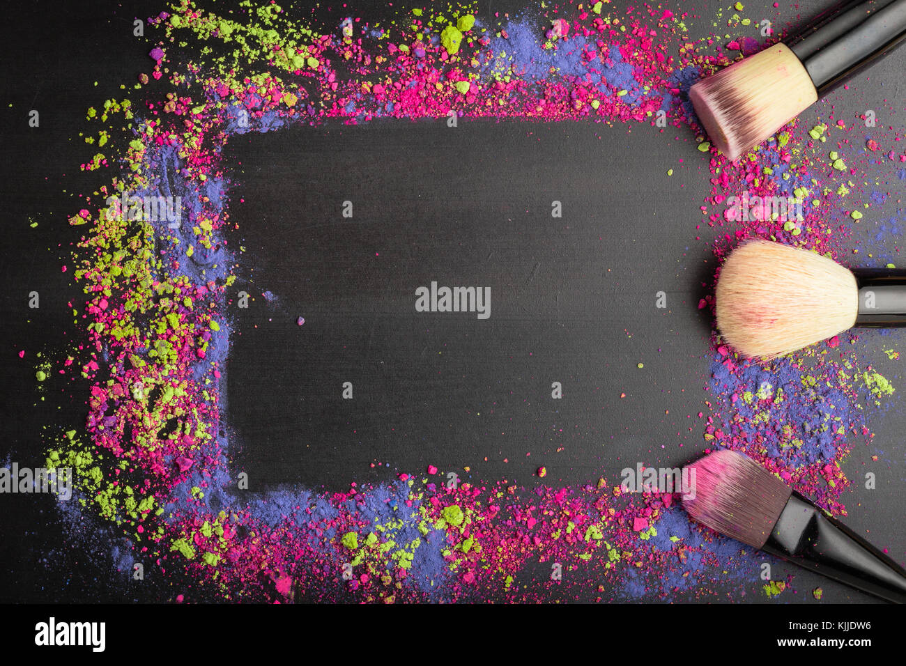 Makeup frame with professional brushes on black texture Stock Photo - Alamy