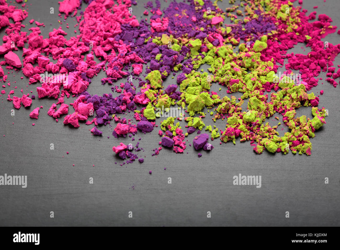Colorful make-up powder on black background Stock Photo - Alamy