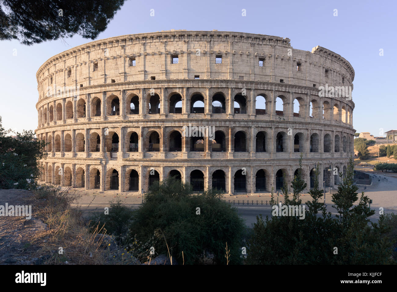 The ancient Roman amphitheater appears complete in the sunrise, with no ...