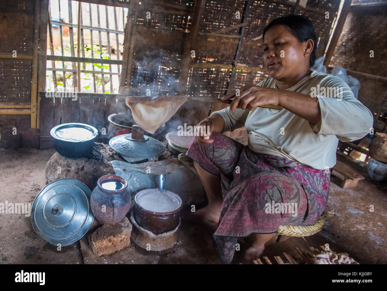 Woman cooking Burmese Crepes in vlllage near Inle lake Myanmar Stock ...