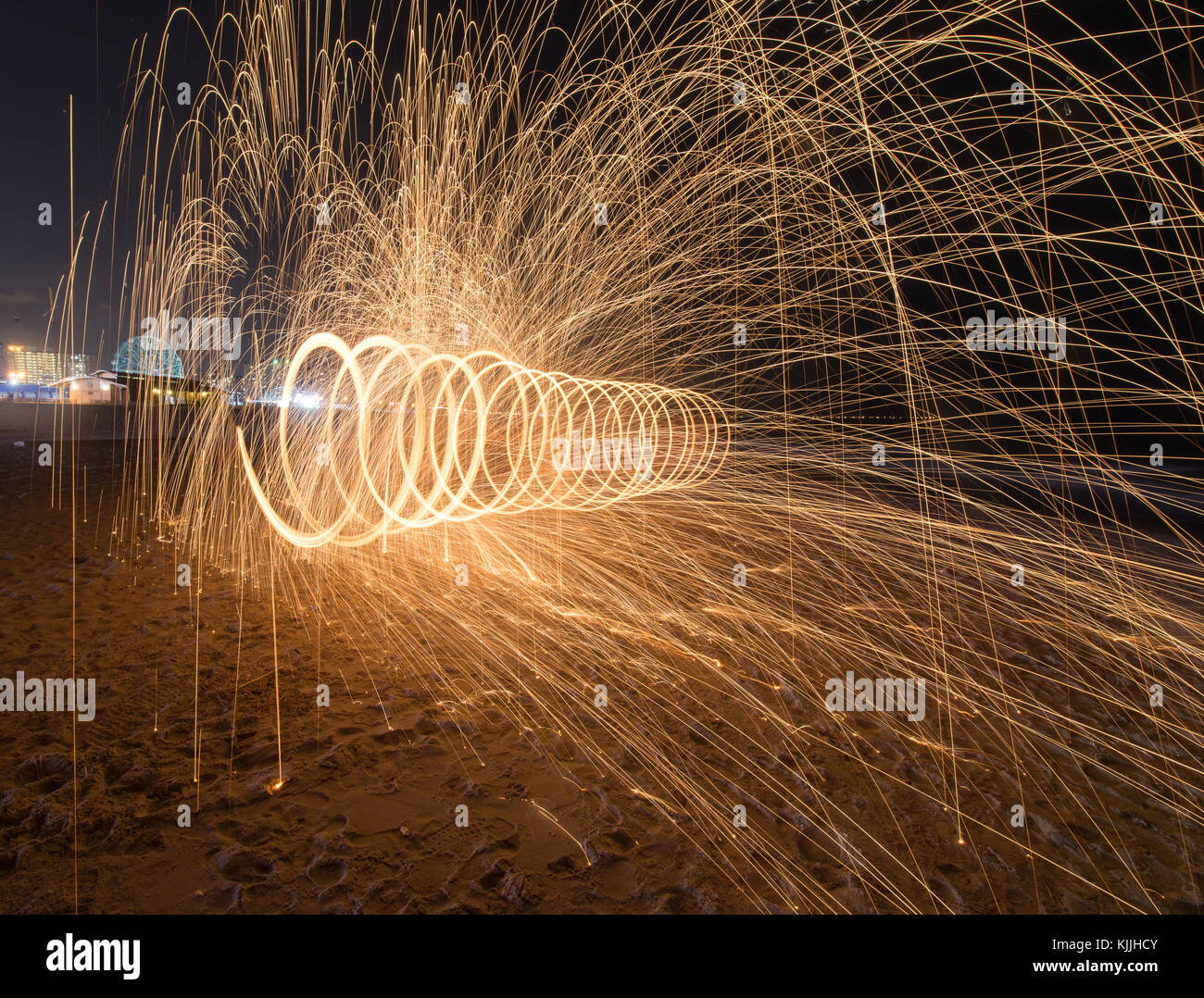 Showers of hot glowing sparks from spinning steel wool at Coney Island ...