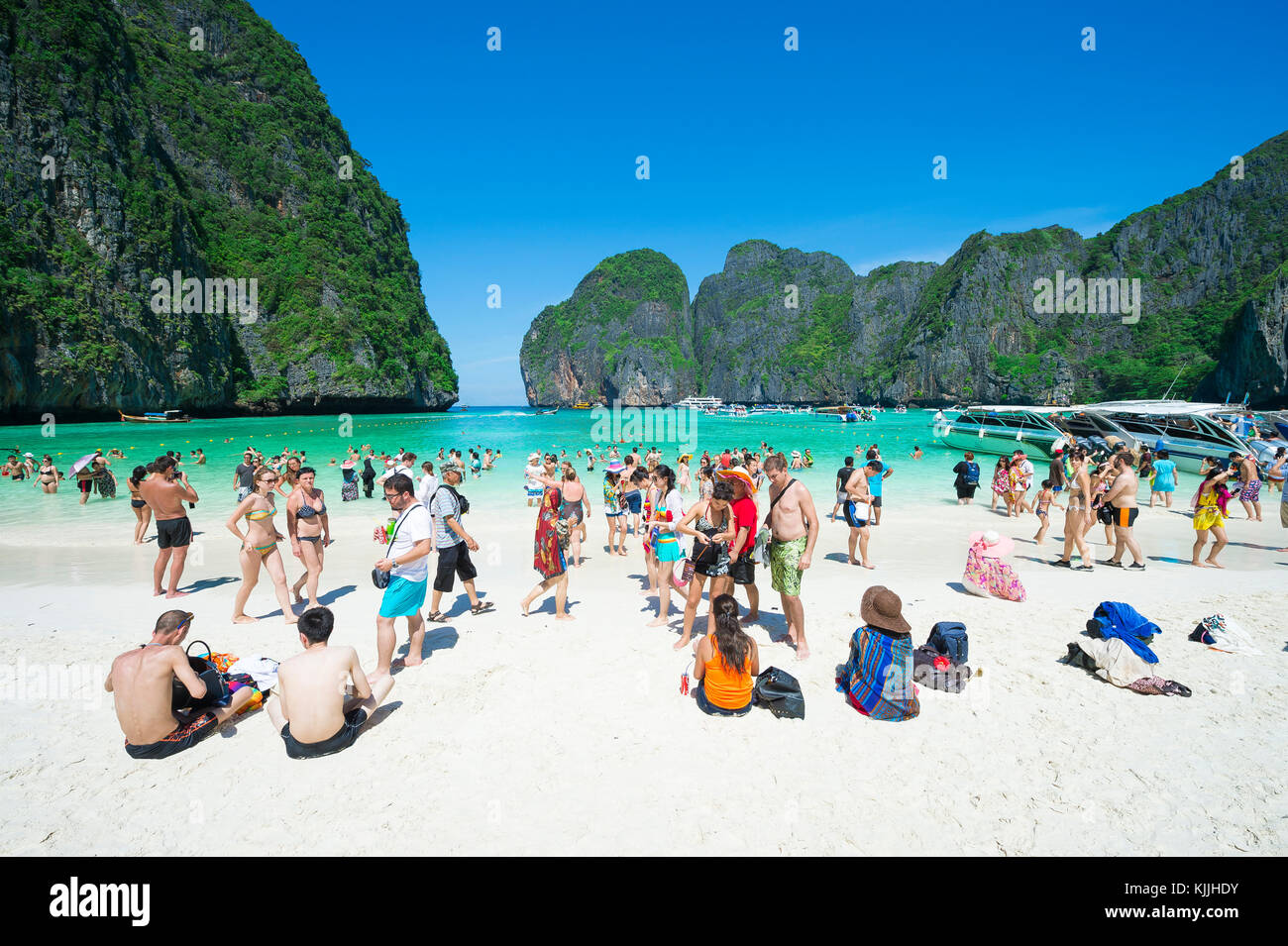 MAYA BAY, THAILAND - NOVEMBER 12, 2014: Crowds of sunbathing visitors ...