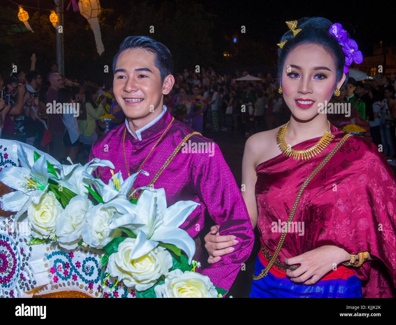 Participants in a parade during Yee Peng festival in Chiang Mai ...