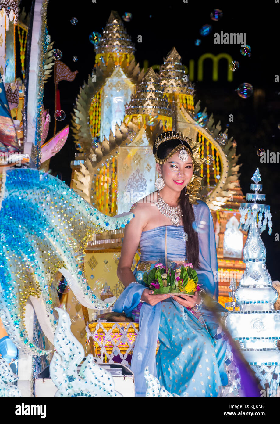 Participant in a parade during Yee Peng festival in Chiang Mai ...