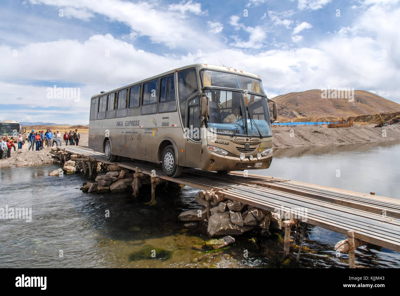 AUGUST 16, 2006 - PUKARA, PERU: Tourist bus crossing a wooden bridge ...