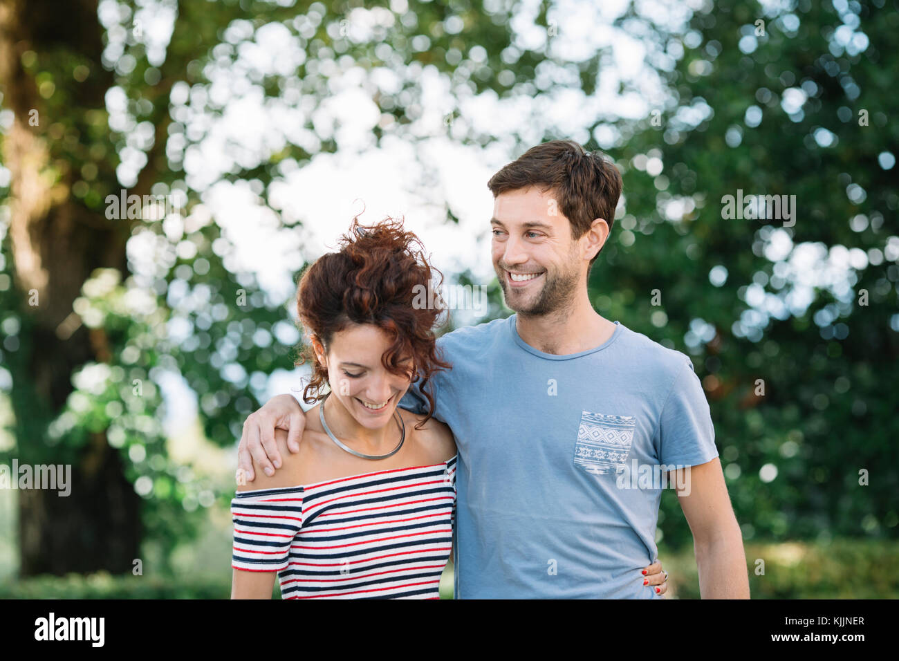Couple in love in a park Stock Photo - Alamy