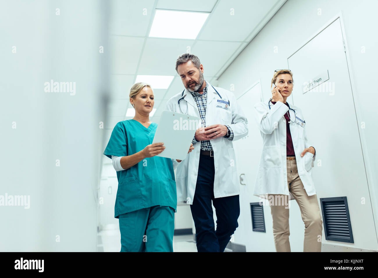 In hospital healthcare professionals walking hi-res stock photography ...