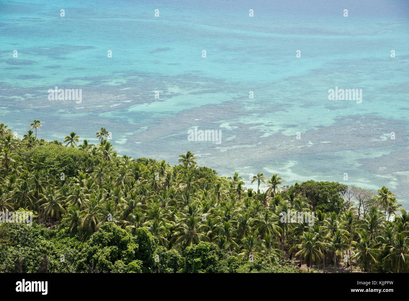 Elevated view from tropical mountain side over the Great Astrolabe Reef ...