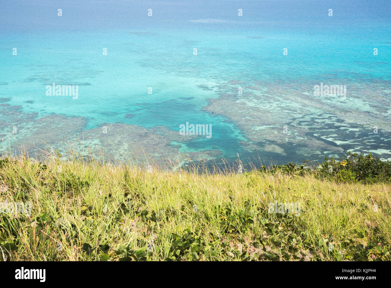 Elevated view from tropical mountain side over the Great Astrolabe Reef ...