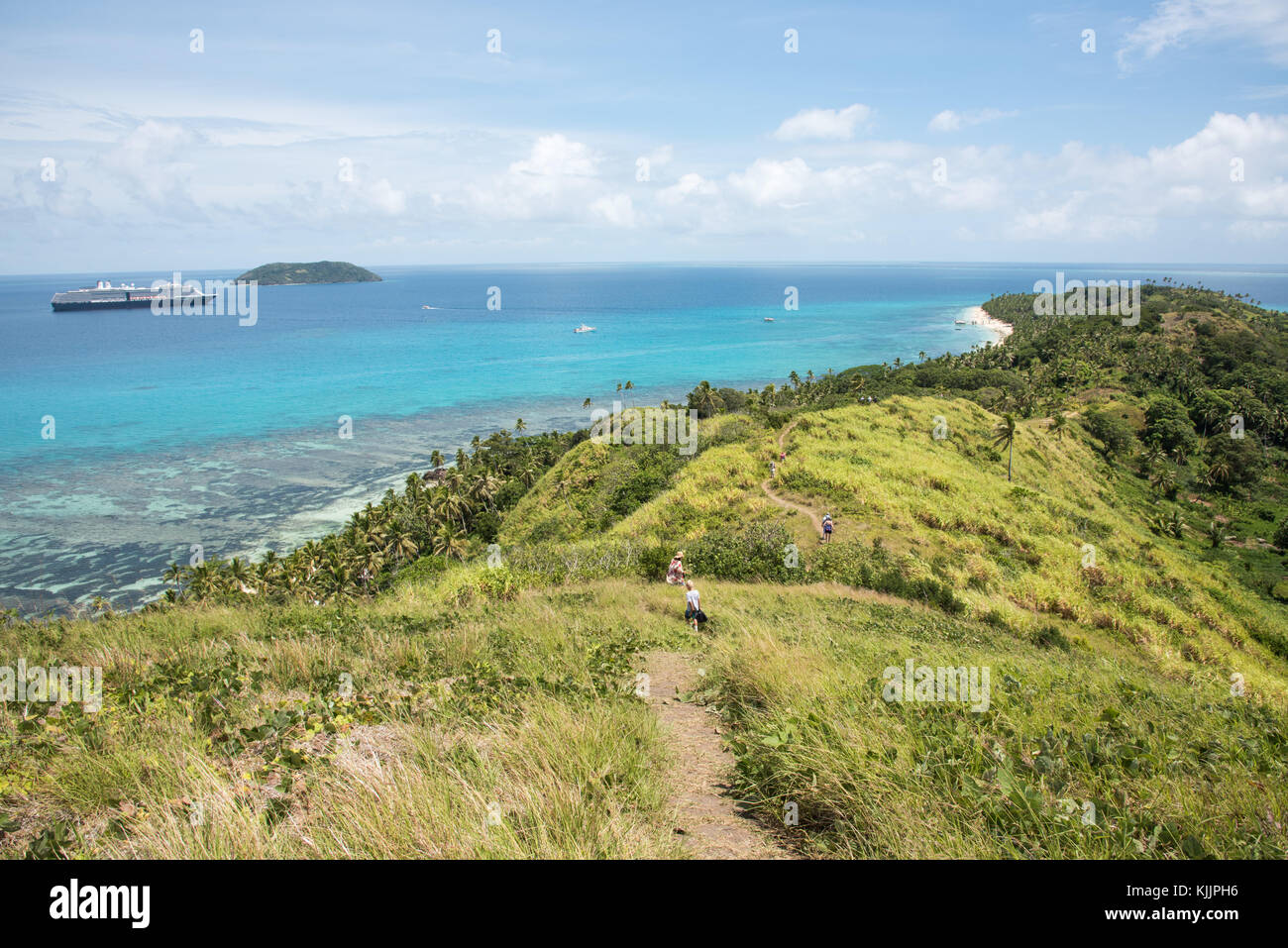 DRAVUNI ISLAND, FIJI, PACIFIC ISLANDS-NOVEMBER 29,2016: People hiking ...
