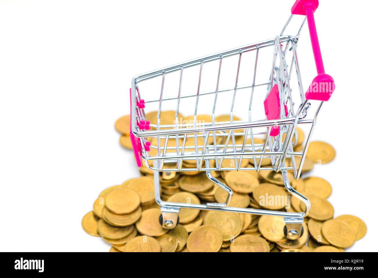 Stack of coins and shopping cart or supermarket trolley isolated on ...