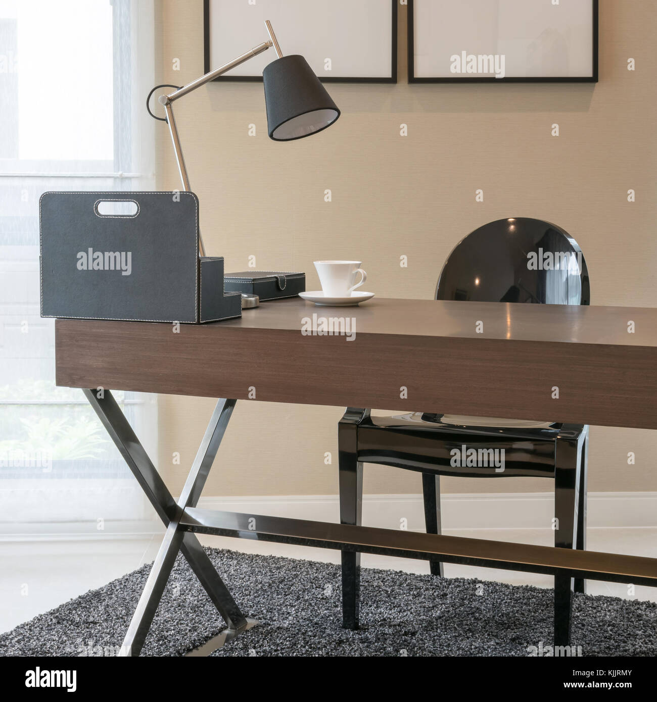 wooden table and books in modern working room interior Stock Photo - Alamy