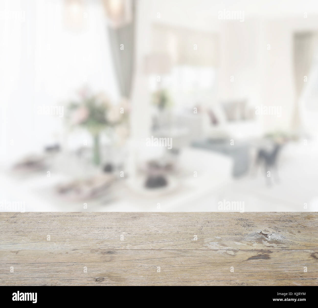 wooden table top with blur of dining table continue to living area ...