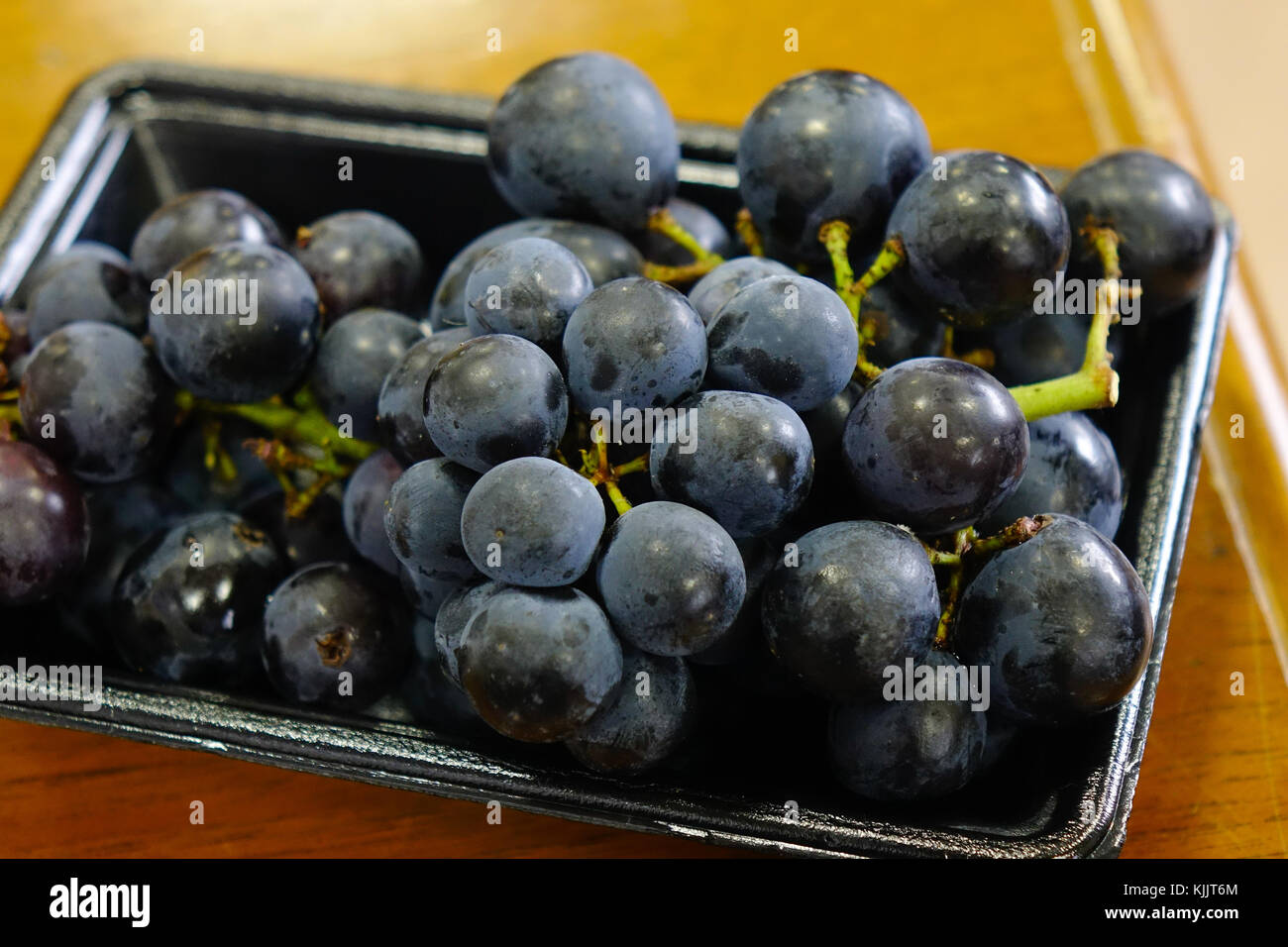 Close-up of Kyoho grapes (giant mountain grapes) at supermarket in ...