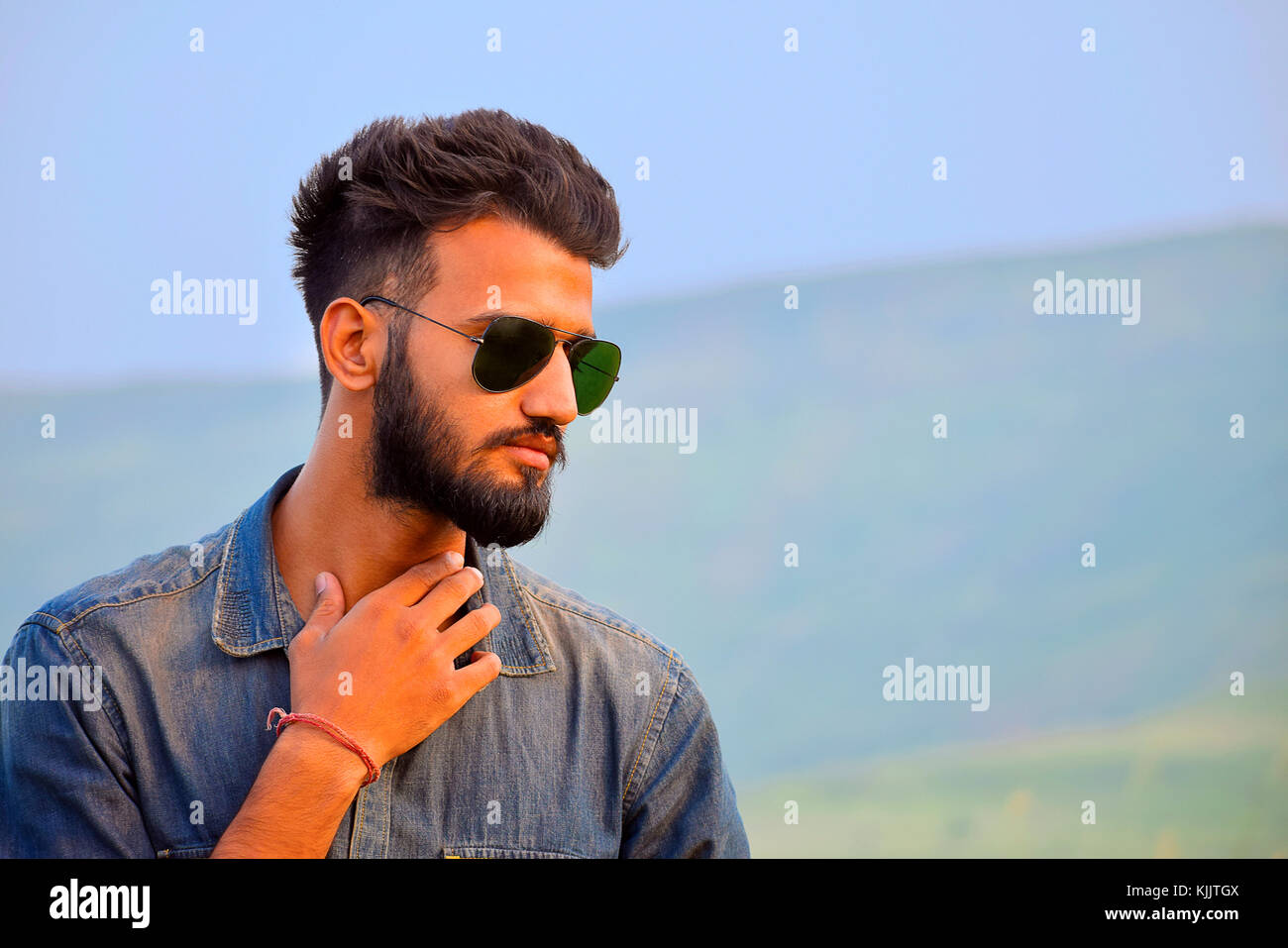 Indian Boy with hand on chin, Pune, Maharashtra Stock Photo - Alamy