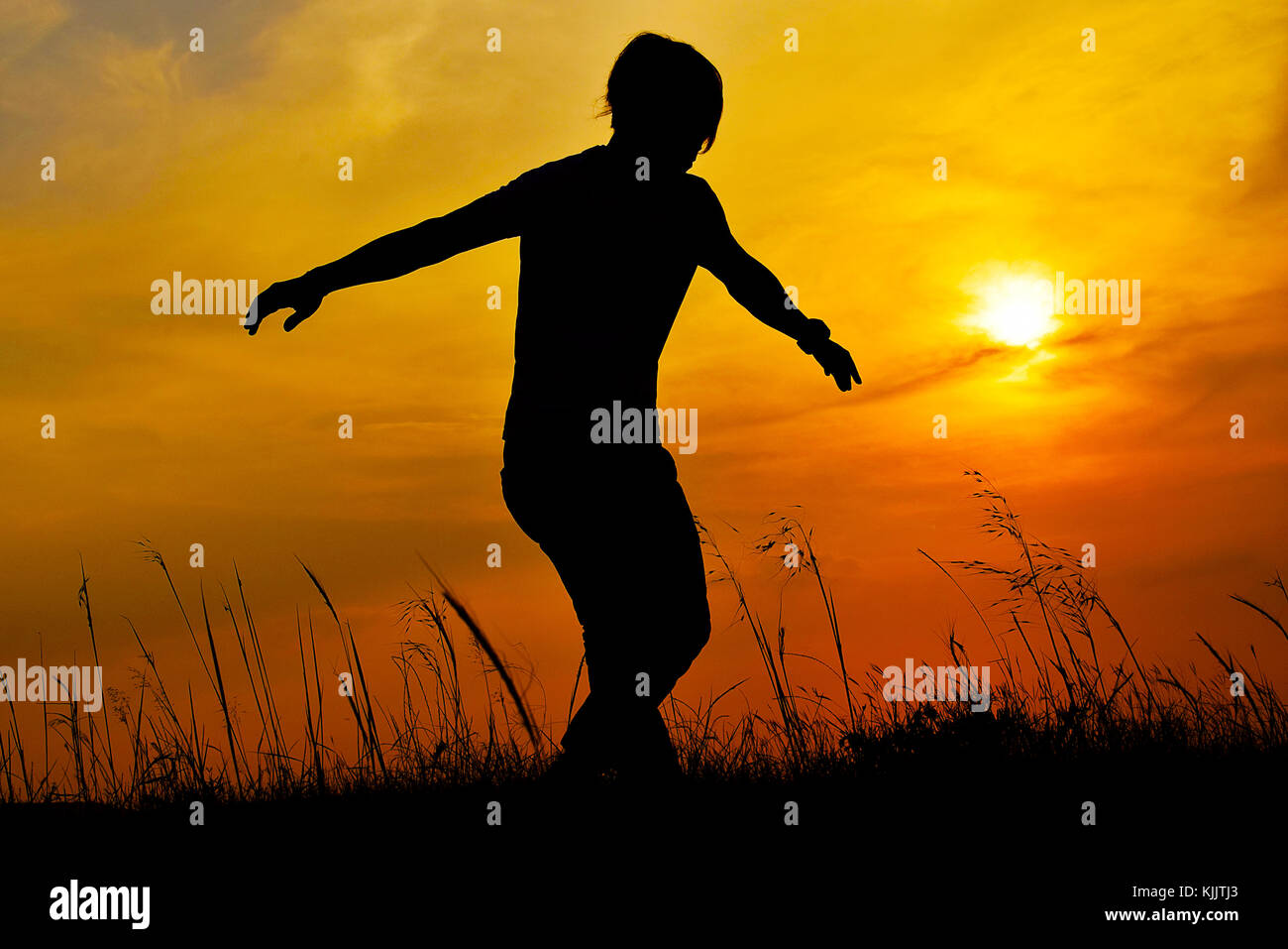 Silhouette of a Hip Hop Dancer posing near mountain at sunset, Pune ...