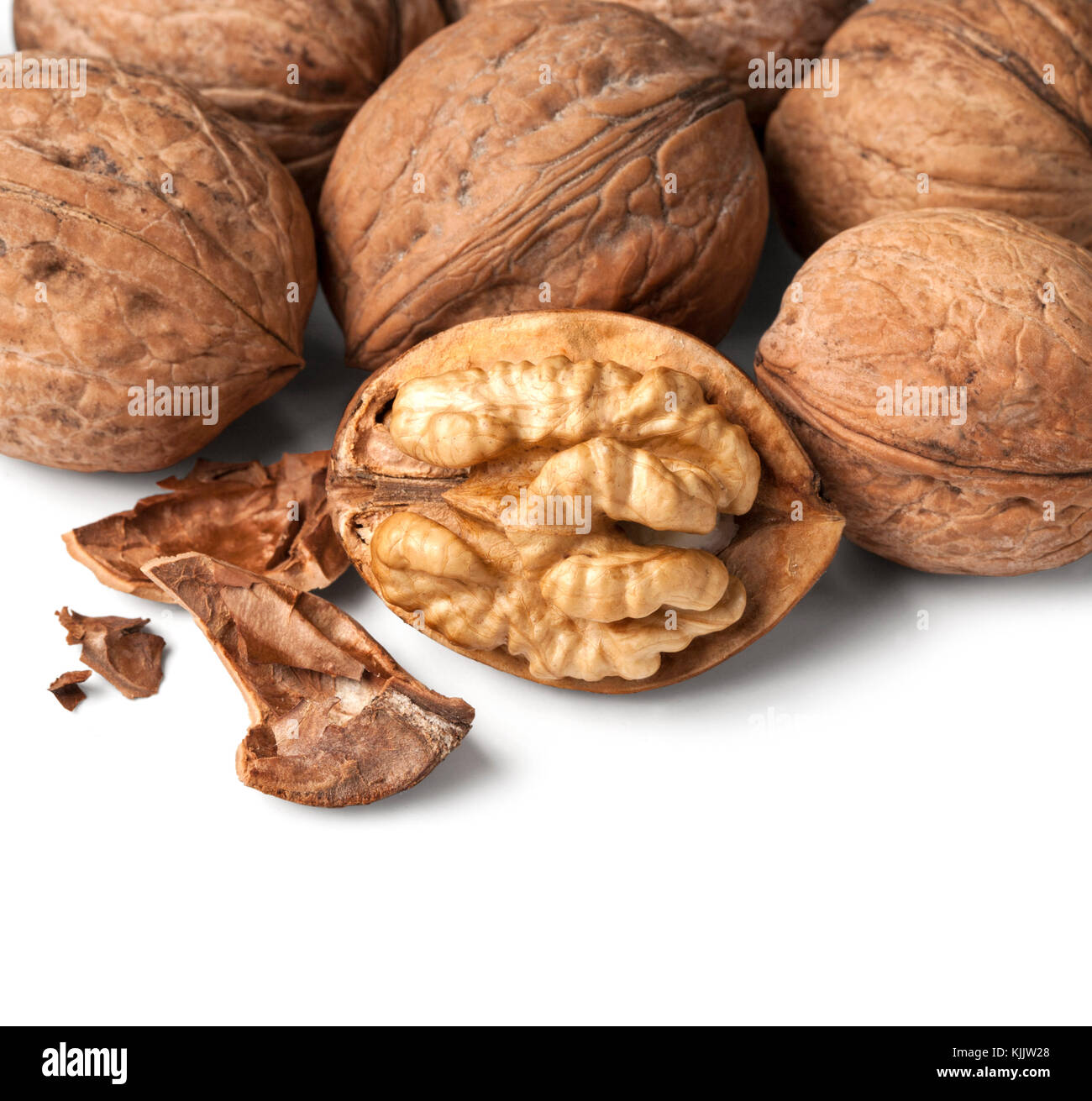 walnut and a cracked walnut isolated on the white background. With ...