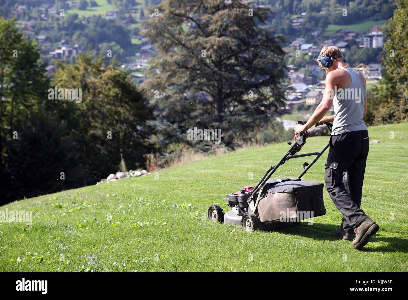 Man mowing the lawn. France Stock Photo - Alamy