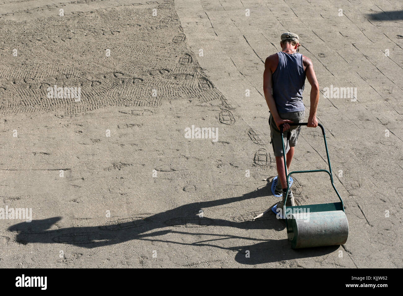 Gardner planting grass seed. France Stock Photo - Alamy