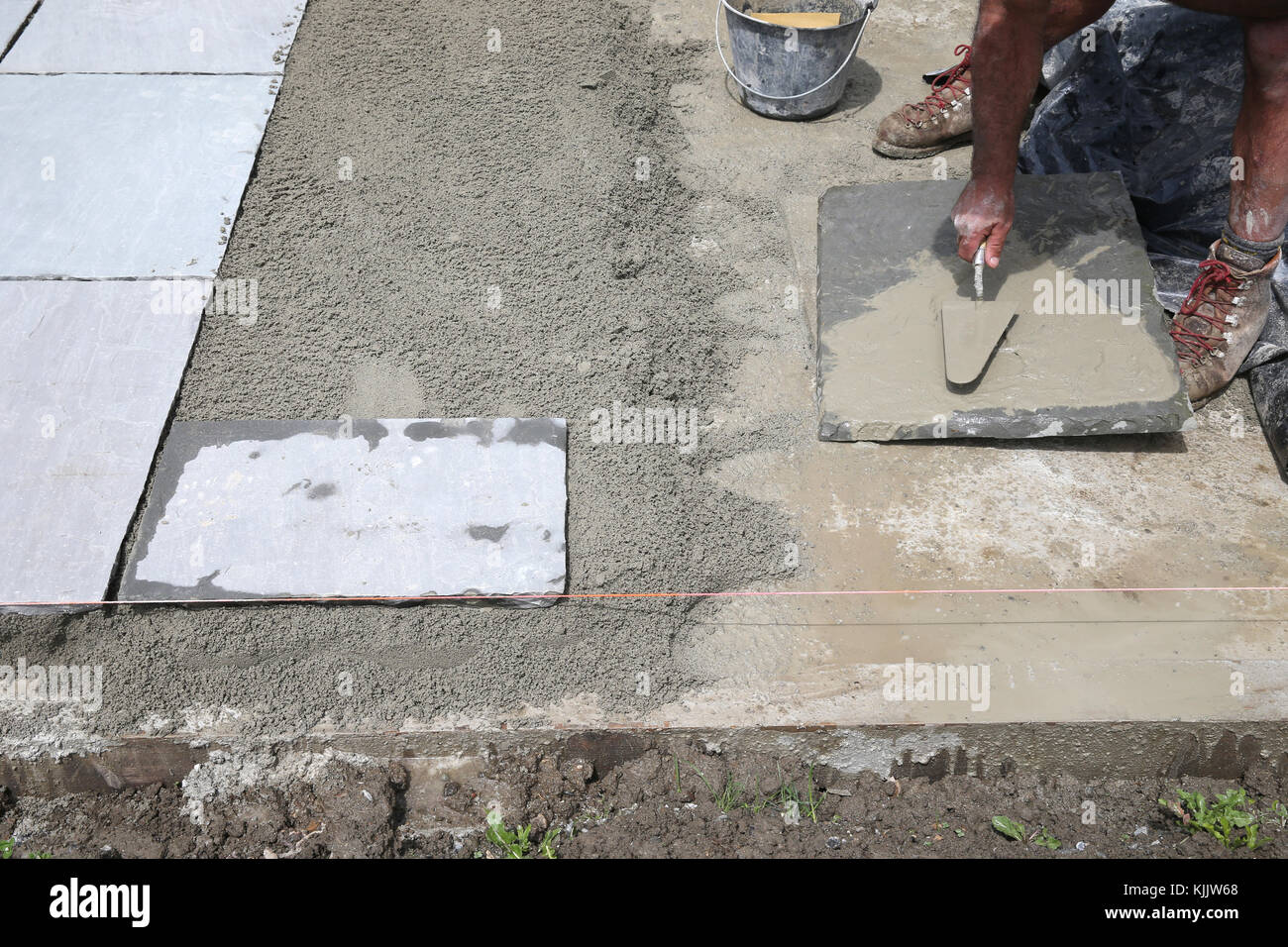 Construction site. Mason laying decorative natural stones. France Stock ...